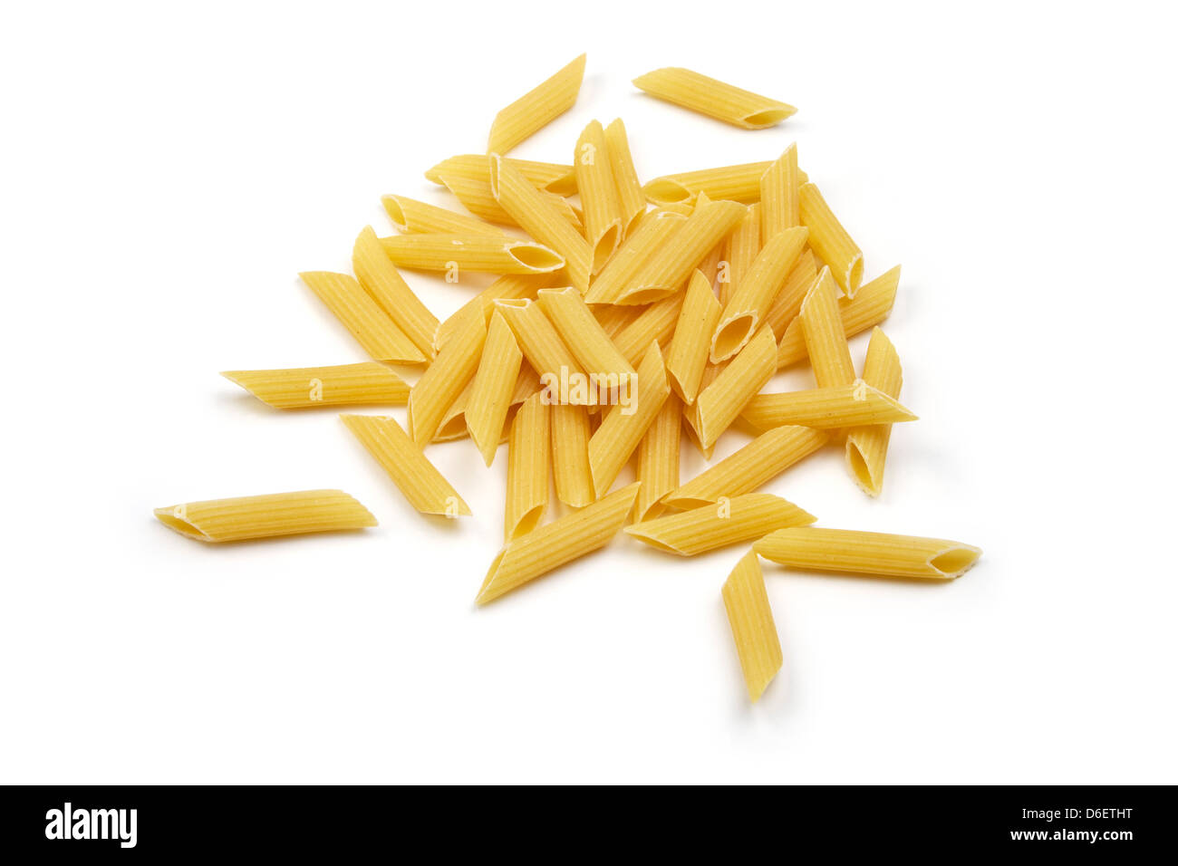 Dried Penne pasta on white background Stock Photo - Alamy