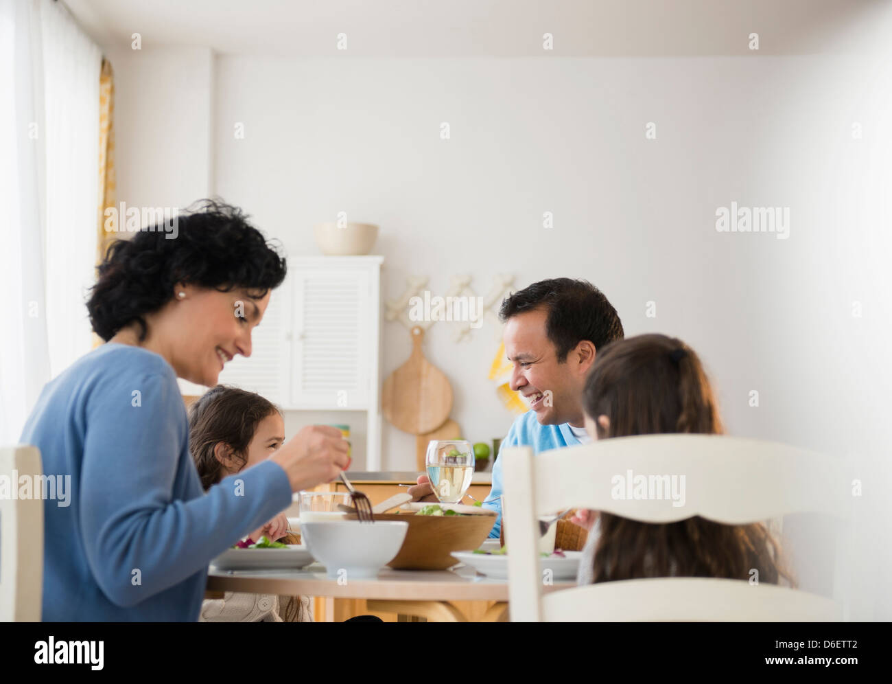 Family eating together at table Stock Photo - Alamy