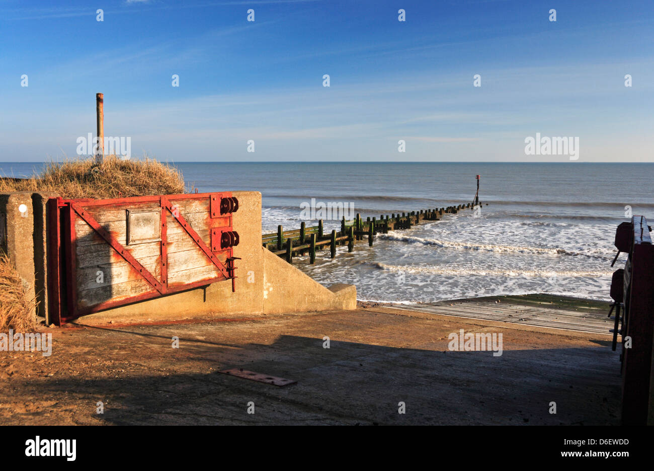 A view of flood gates and slipway at Bacton-on-Sea, Norfolk, England ...