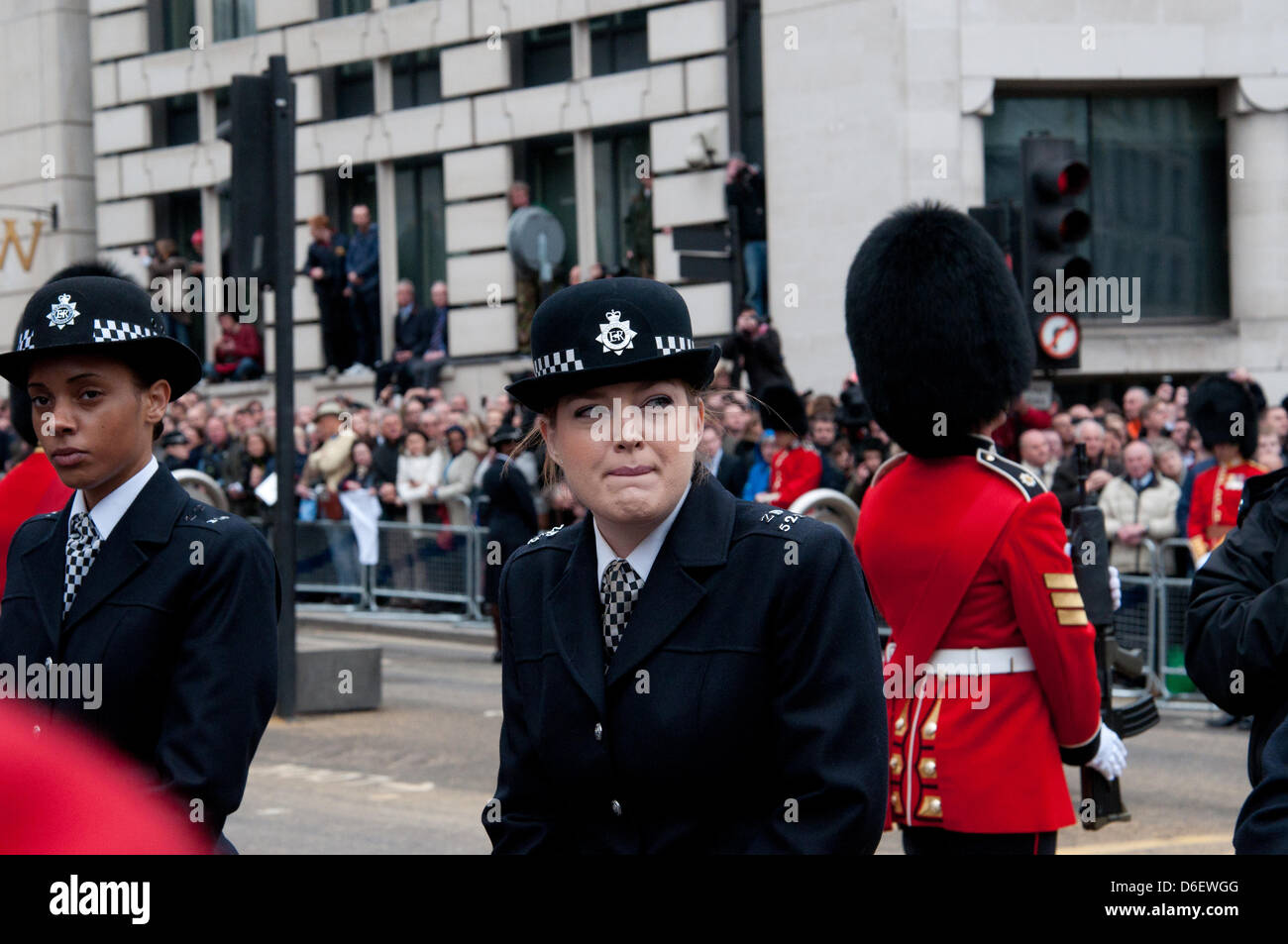 London, England UK 17/04/2013. A police woman stifles a giggle during a ...