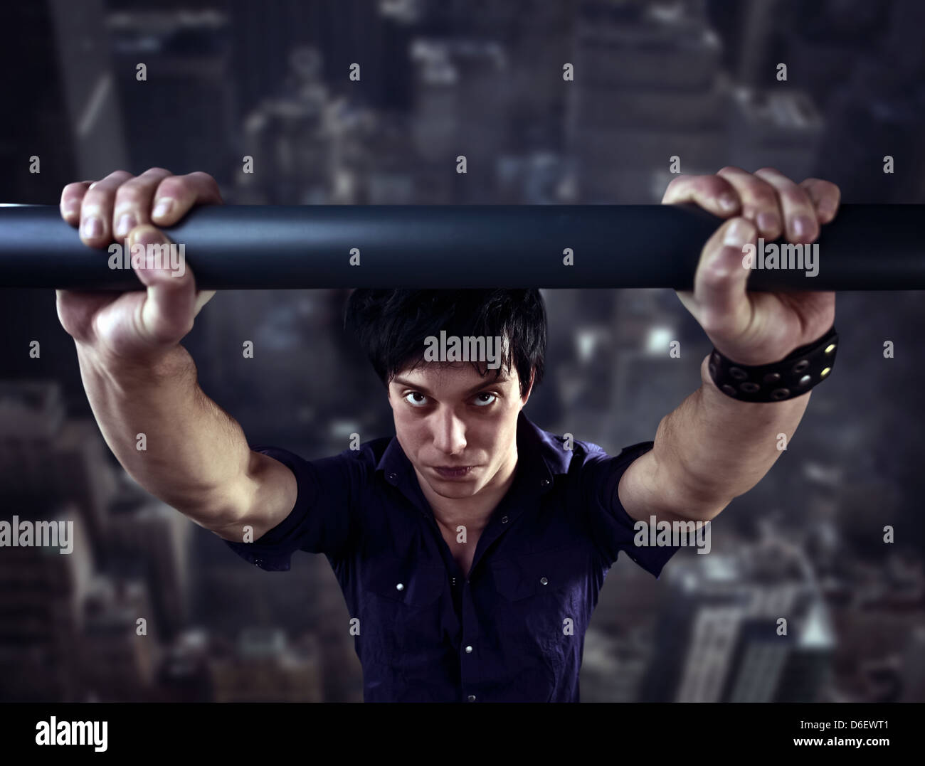 The young man hanging over a city Stock Photo - Alamy