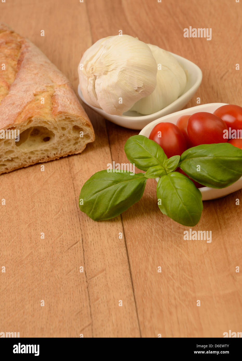 Ciabatta with cooking ingredients on a wooden background Stock Photo ...