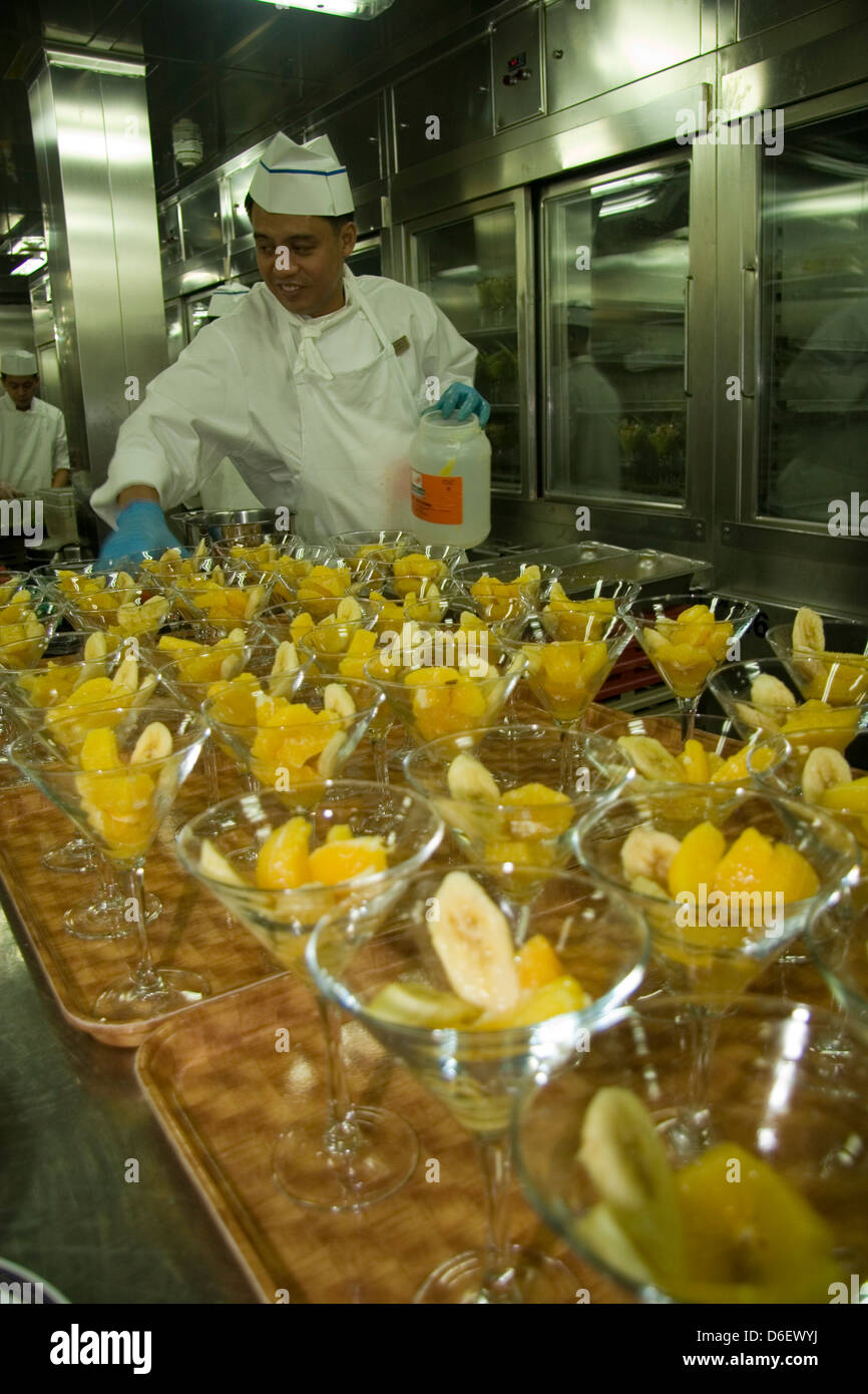 Prep cook preparing dessert in the kitchen of a cruise ship Stock Photo ...