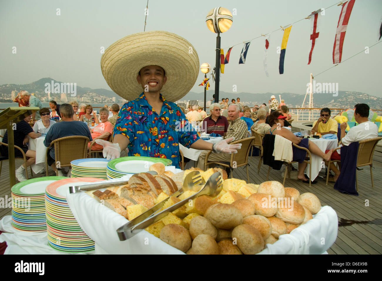 cruise ship employee showing a buffet station Stock Photo - Alamy