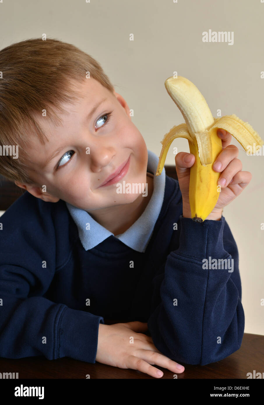 Boy eating banana school hi-res stock photography and images - Alamy