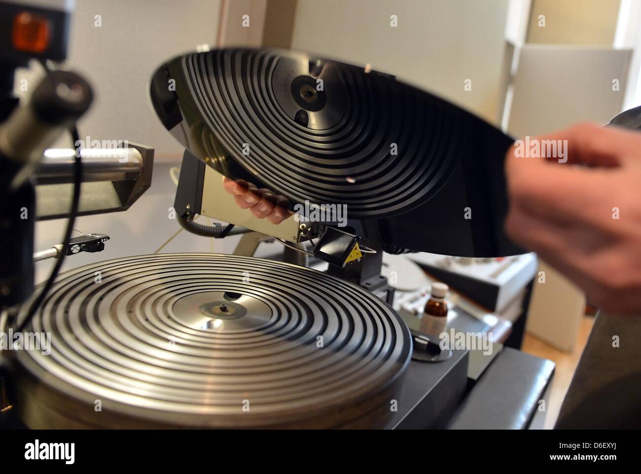 Sound technician Rainer Maillard operates an analogue Neumann vinyl ...