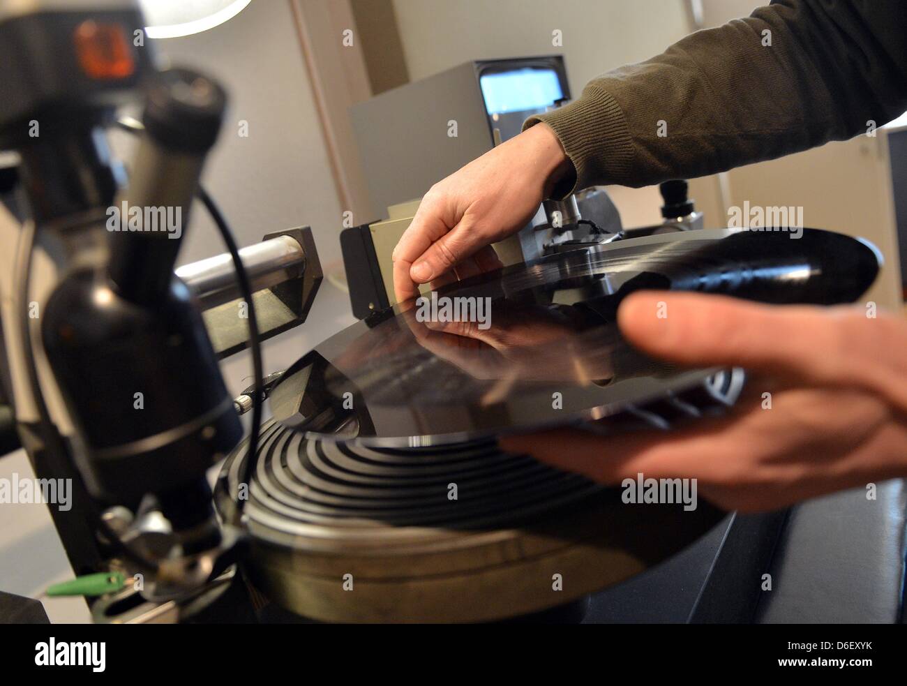 Sound technician Rainer Maillard operates an analogue Neumann vinyl ...