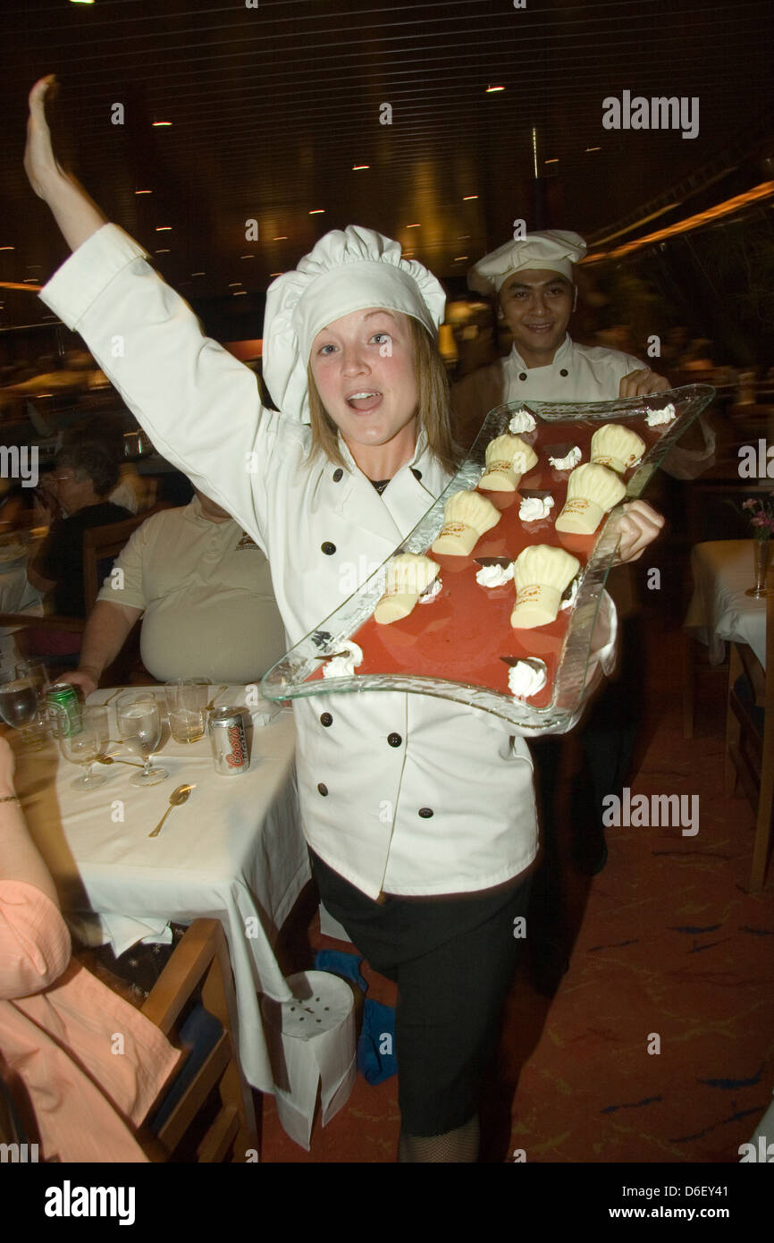 Waiters serving night dessert on a cruise ship Stock Photo - Alamy