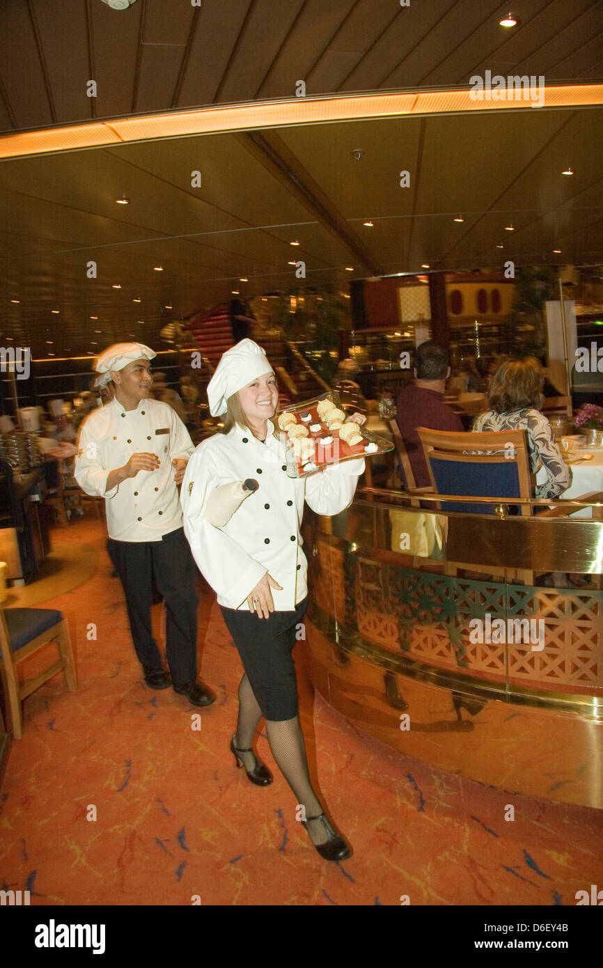 Waiters serving night dessert on a cruise ship Stock Photo - Alamy