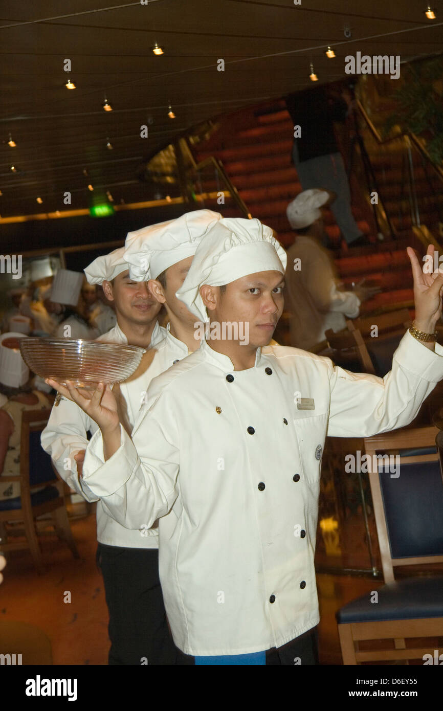 Waiters serving night dessert on a cruise ship Stock Photo - Alamy