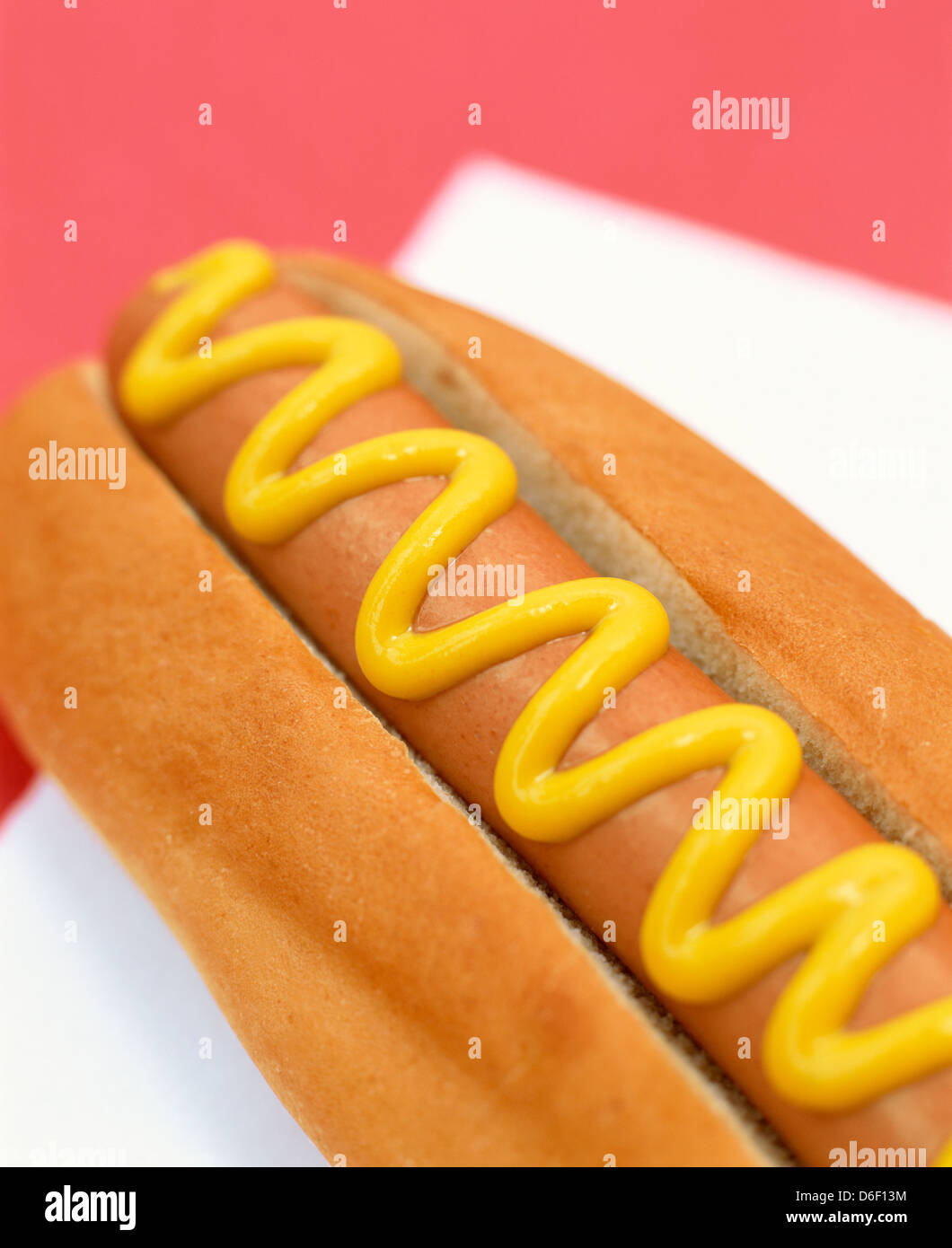 Hot Dog with Mustard Stock Photo - Alamy