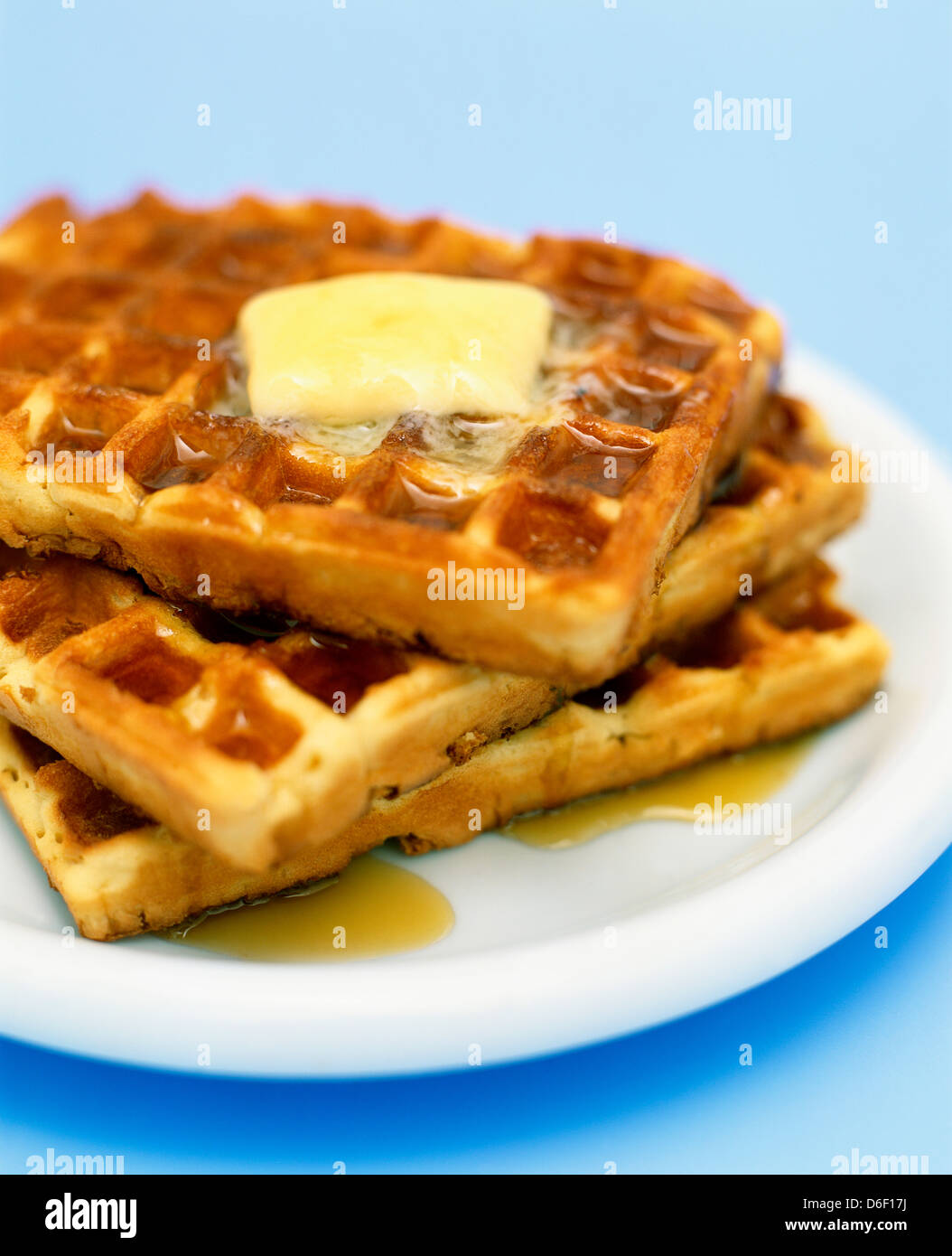 Waffles with Butter and Maple Syrup Stock Photo - Alamy