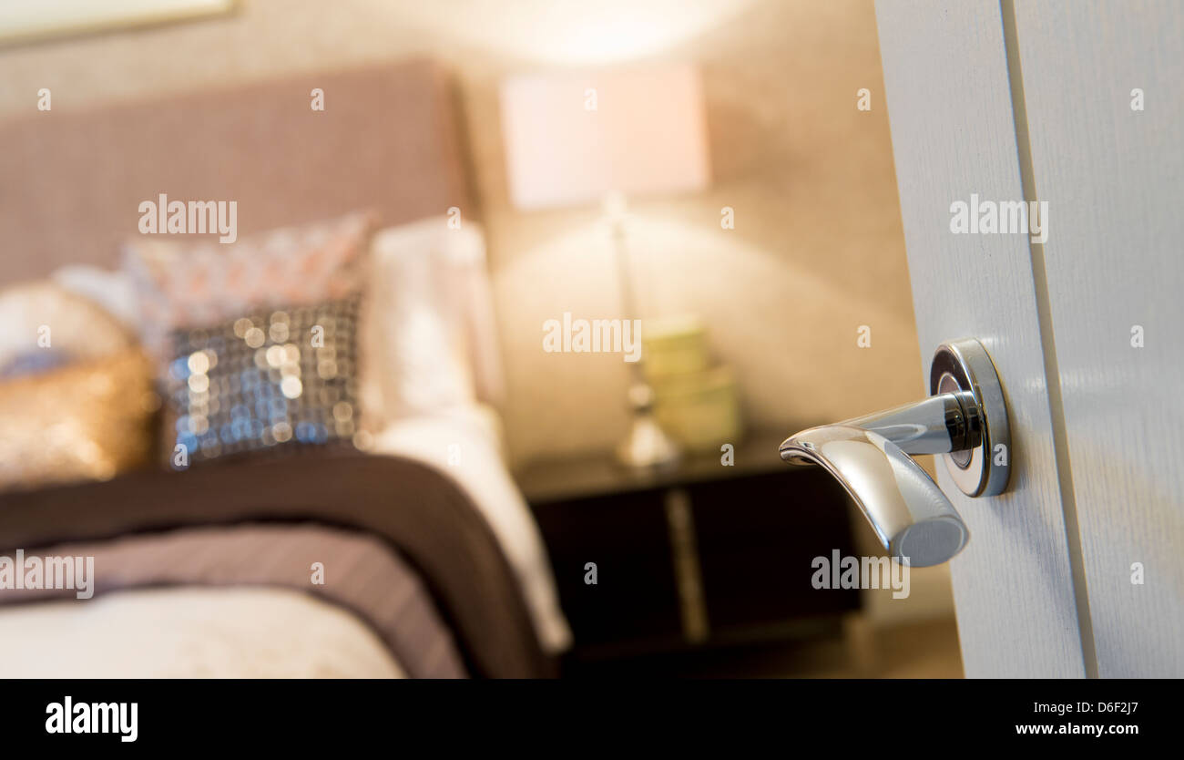 Door opening into a bedroom Stock Photo - Alamy