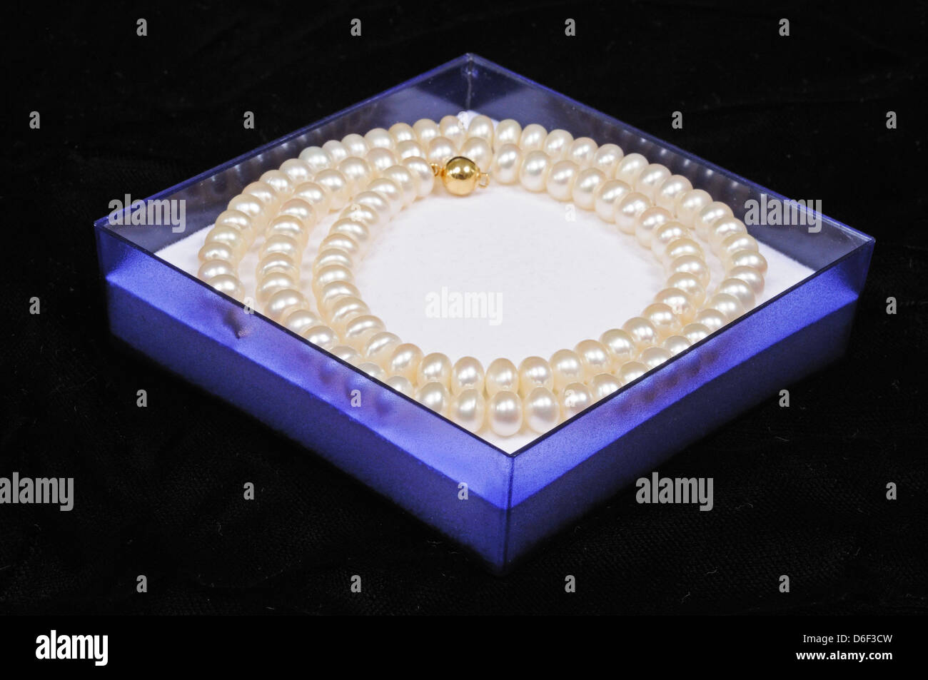 Cultivated pearl necklace in a box against a black background Stock ...