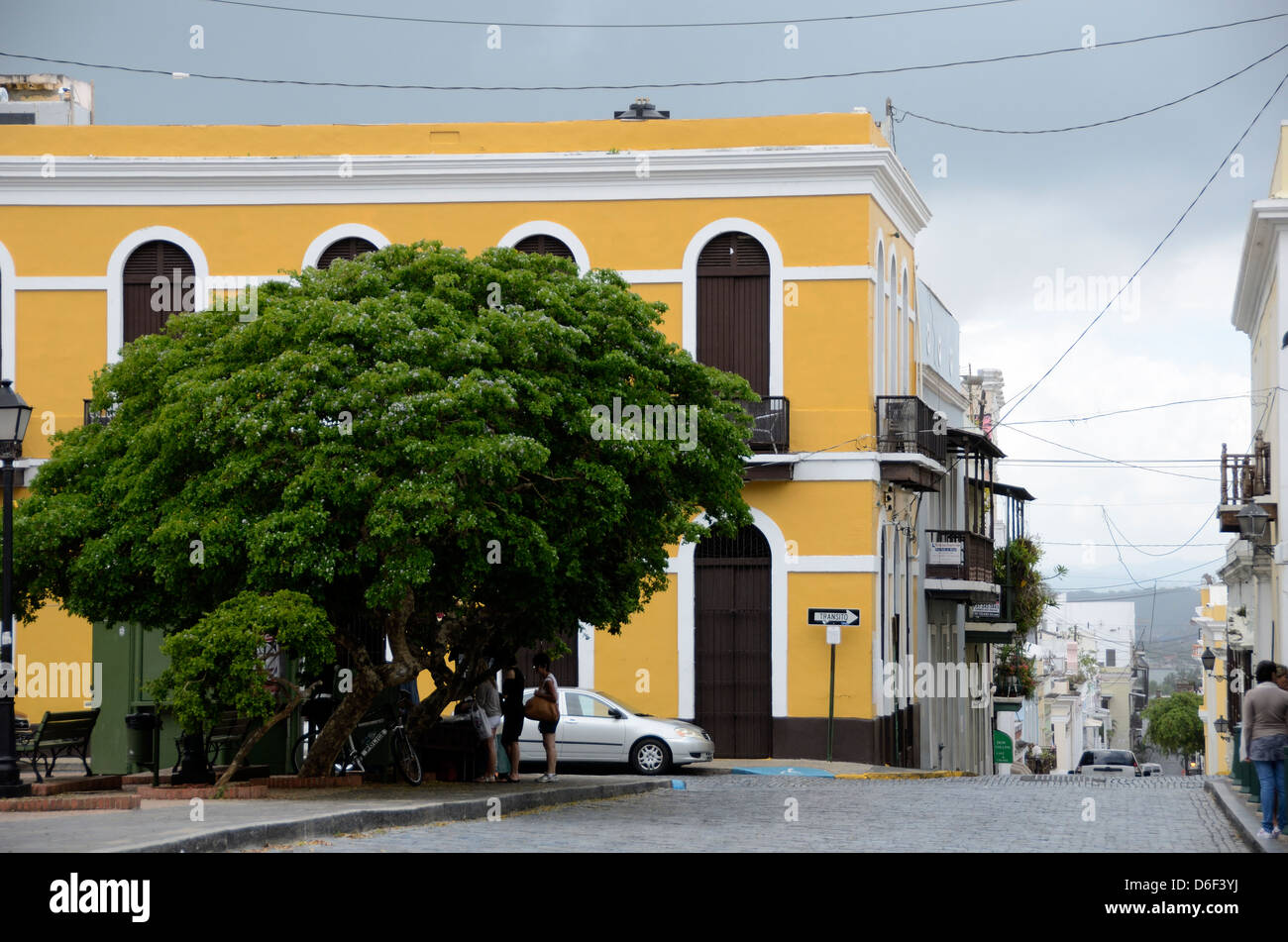 Yellow building and cobblestone street in Old San Juan, Puerto Rico ...