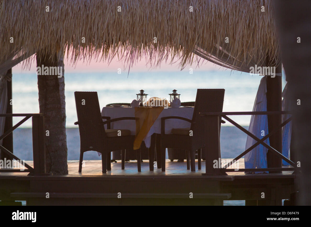 Romantic sunset table for two overlooking the sea at the Rasa Ria hotel ...
