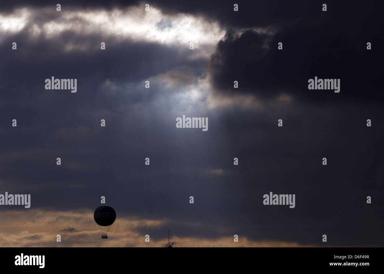 Berlin, Germany, sun shining through a thick cloud cover Stock Photo ...