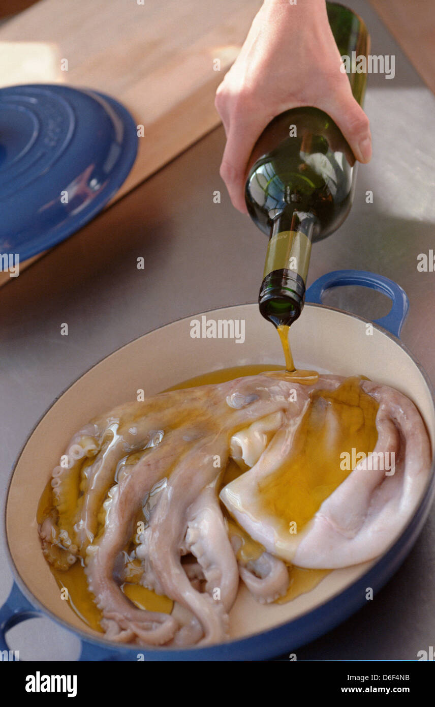 Pouring Oil onto Octopus Stock Photo - Alamy