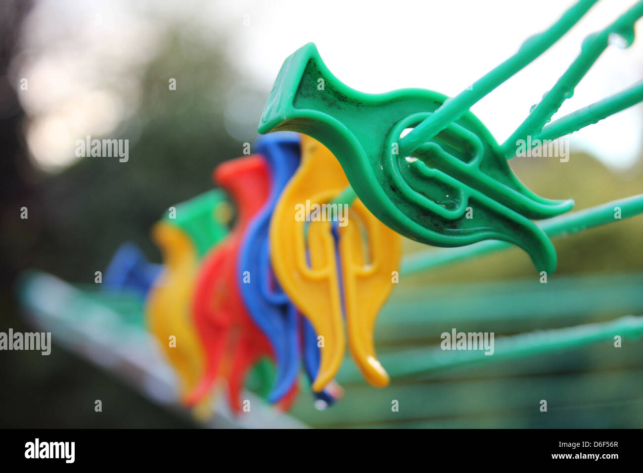 Abstract composition of coloured clothes pegs on washing line Stock ...