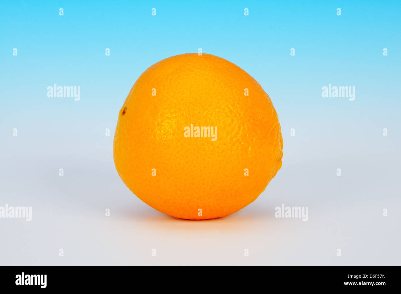 Orange against a blue background Stock Photo - Alamy