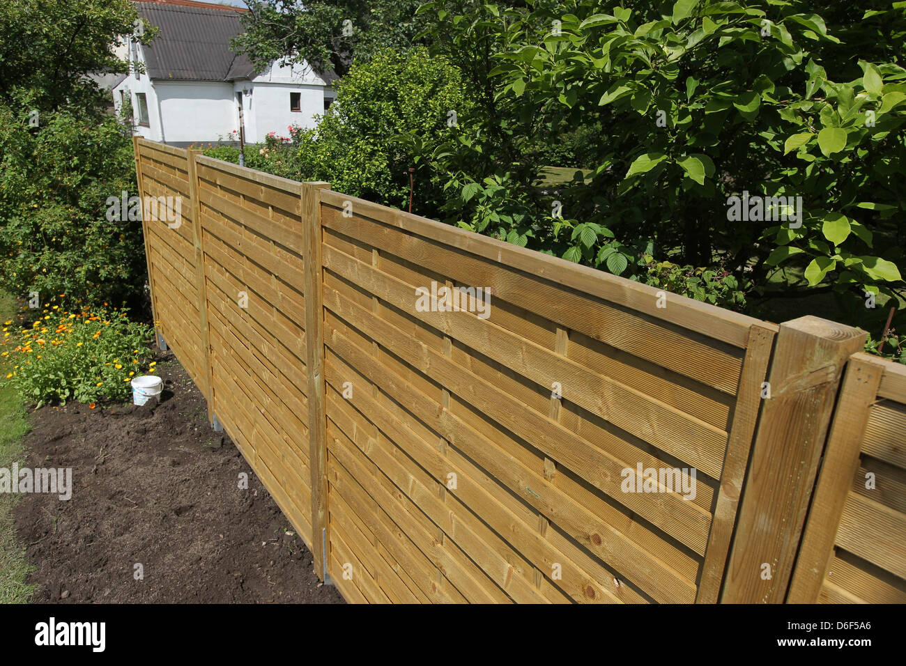 Handewitt, Germany, a garden fence separates from each other two Plots ...