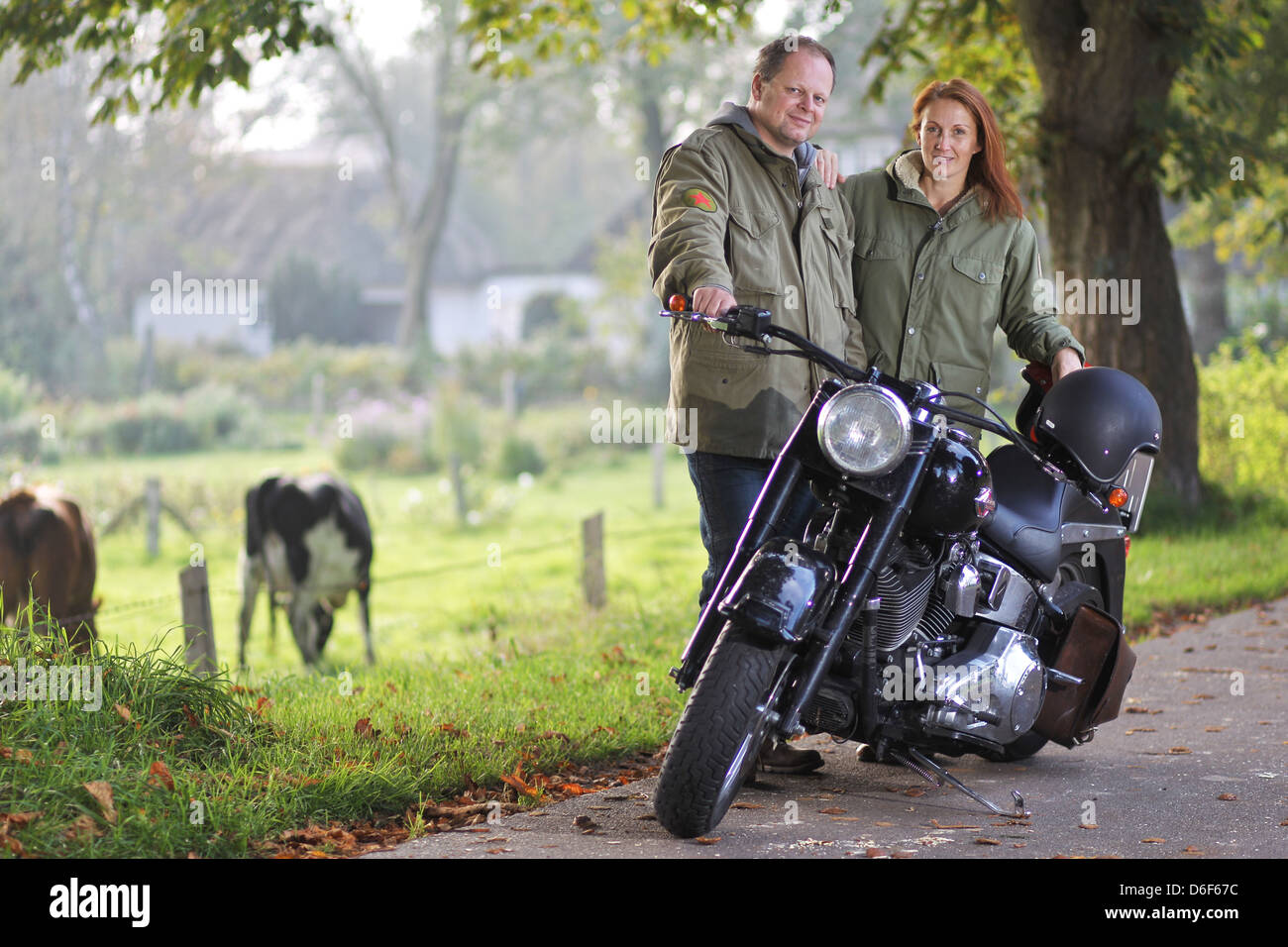 Handewitt, Germany, a couple standing next to his motorcycle, Harley ...