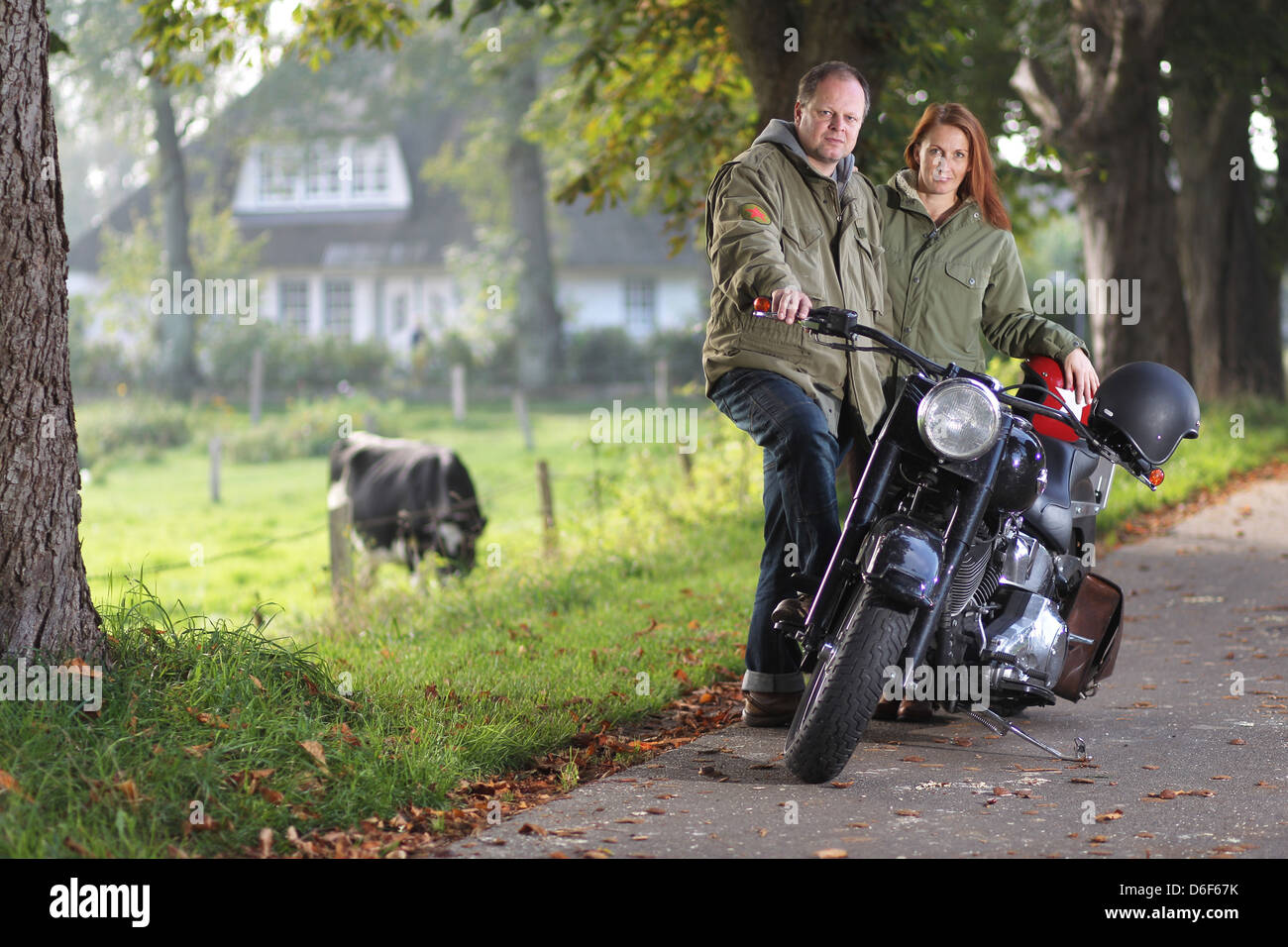 Handewitt, Germany, a couple standing next to his motorcycle, Harley ...