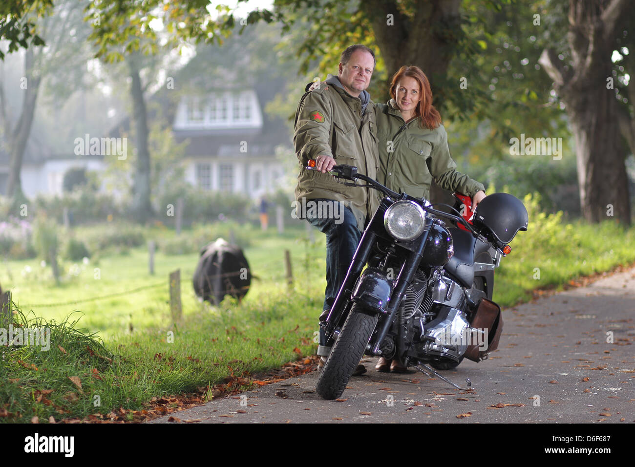 Handewitt, Germany, a couple standing next to his motorcycle, Harley ...
