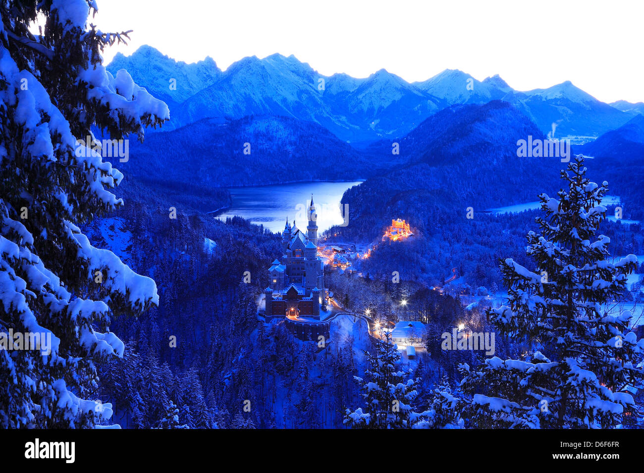 Neuschwanstein castle with lake Alpsee and Hohenschwangau castle (r) at ...
