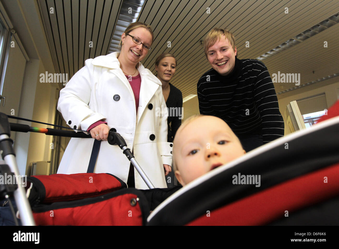 Handewitt, Germany, a small child looks out of the pram in a ...