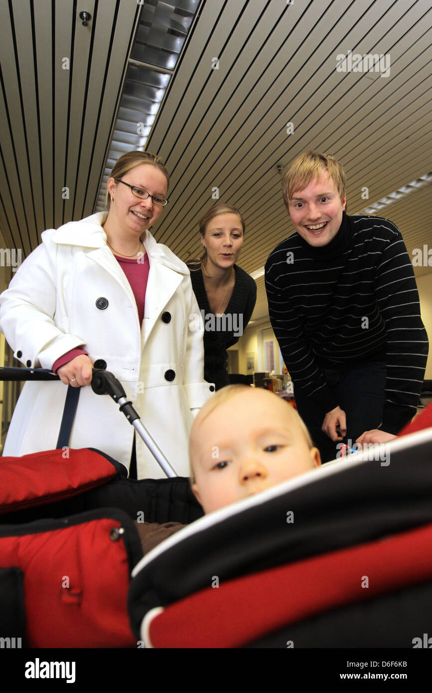 Handewitt, Germany, a small child looks out of the pram in a ...