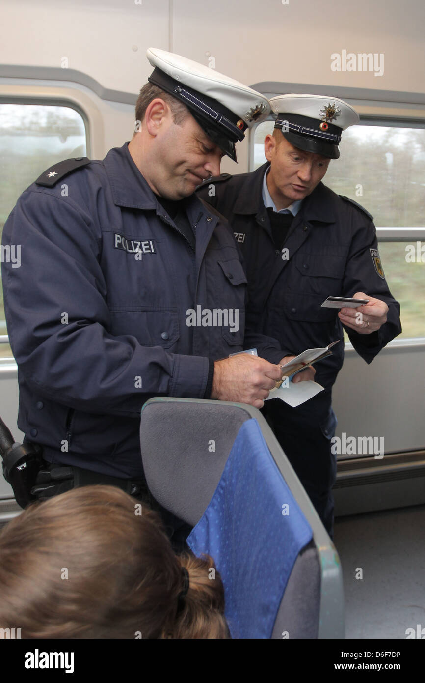 Flensburg, Germany, the federal police at a control in the train of ...