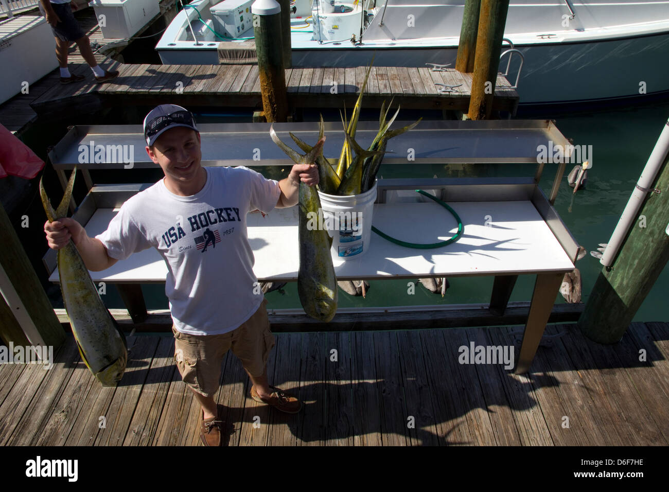 Jordan Calpus of Chaska, MN, displays his catch of dolphin fish (mahi ...