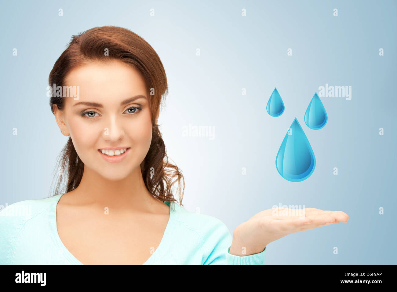 woman showing blue water drops Stock Photo - Alamy