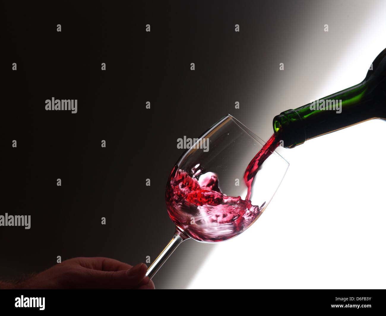 Pouring Red Wine into Glass Stock Photo - Alamy