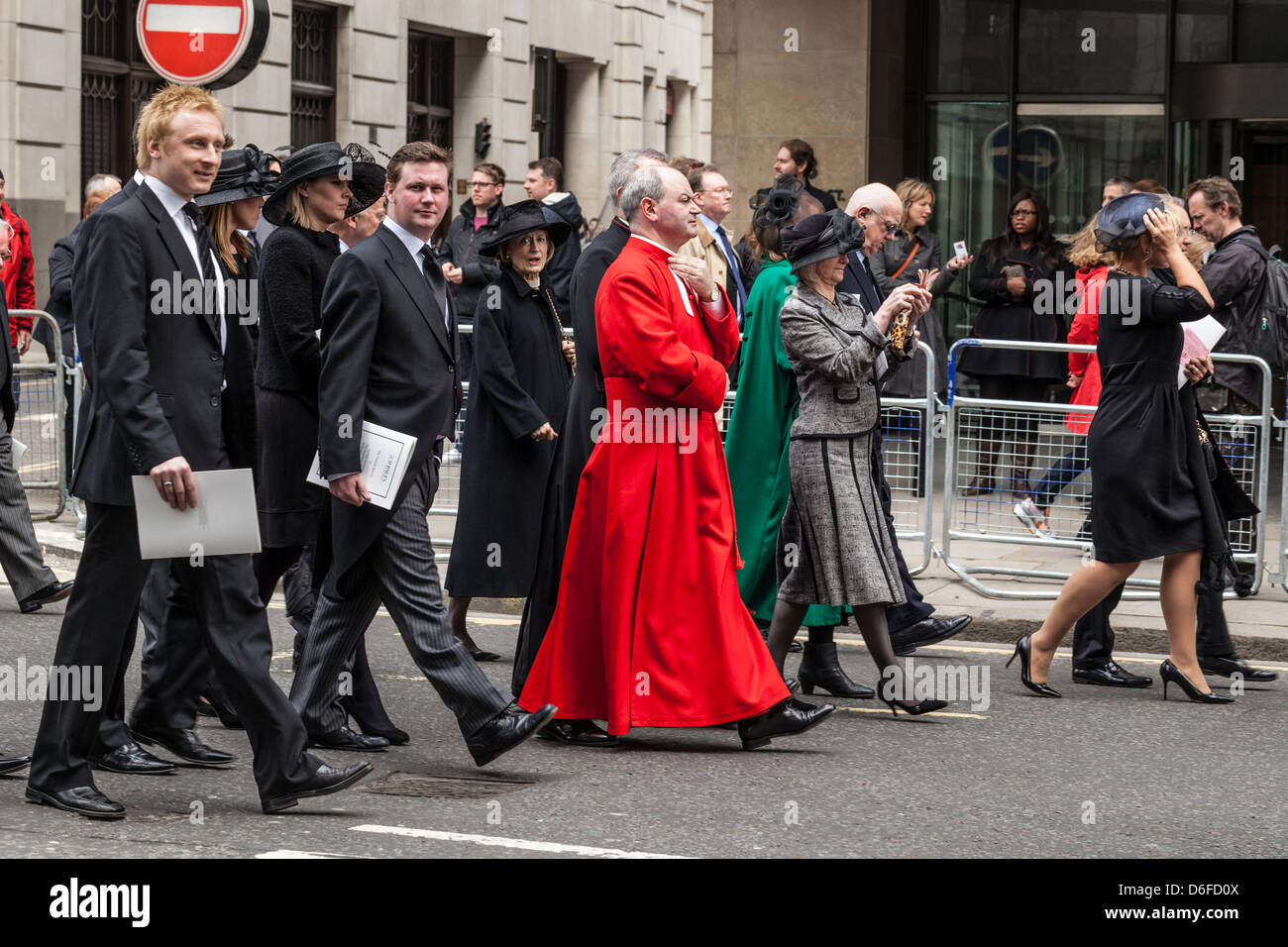 Crowd walking along Canon Street for the Funeral of Baroness Thatcher ...