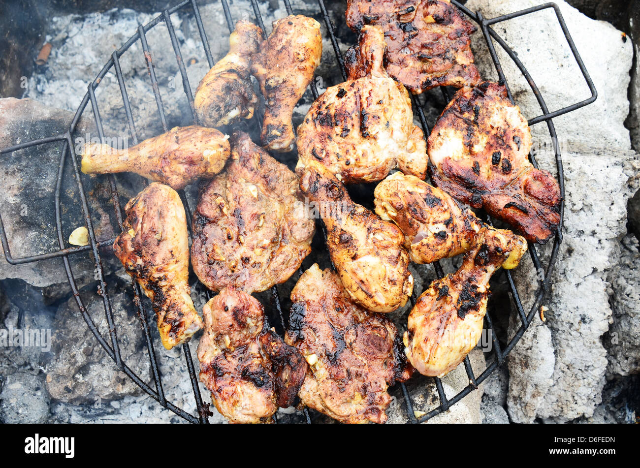 Chicken barbecue on outdoor camping Stock Photo - Alamy