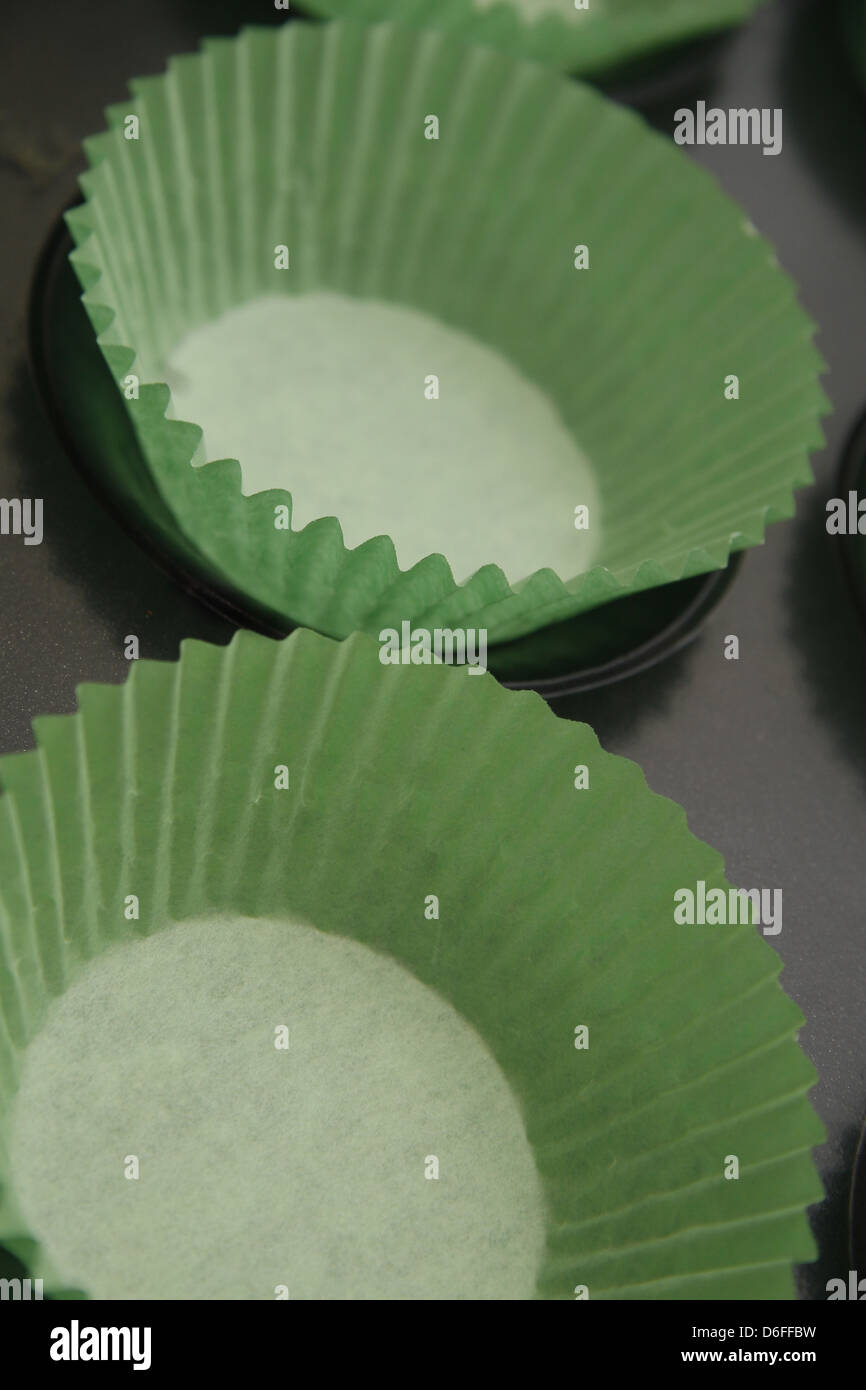 empty green bun cases on bun tray Stock Photo - Alamy