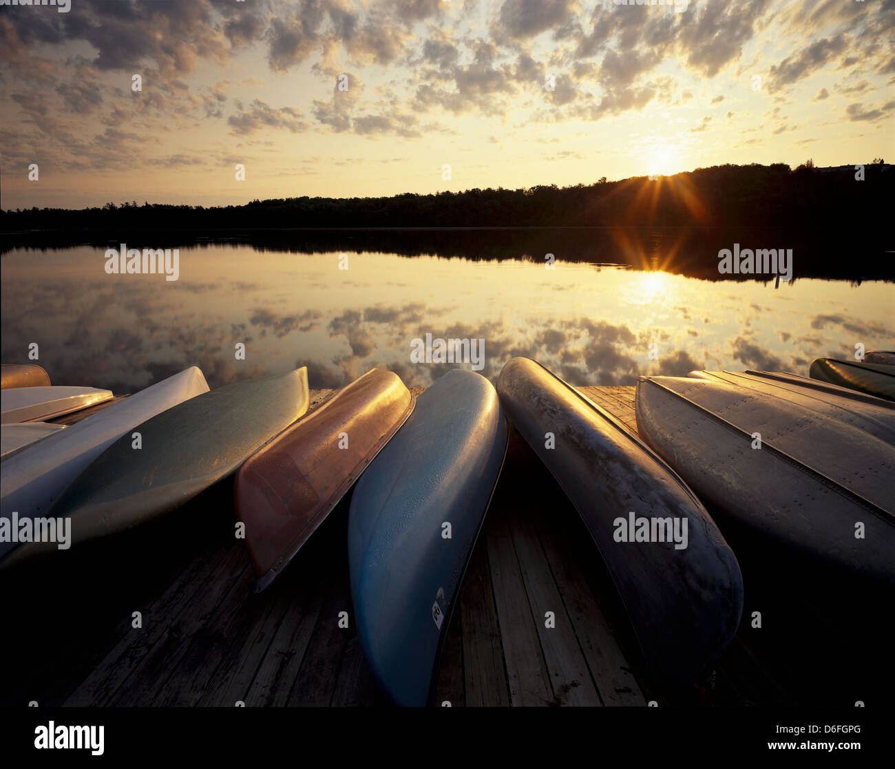 Canoes at sunrise, Eagles Mere Lake, Sullivan County, Pennsylvania, USA ...