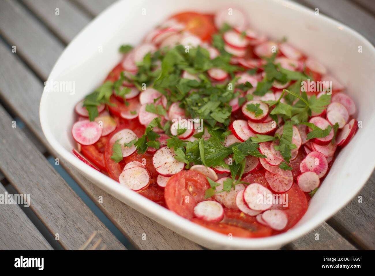 Radish and tomato salad Stock Photo - Alamy
