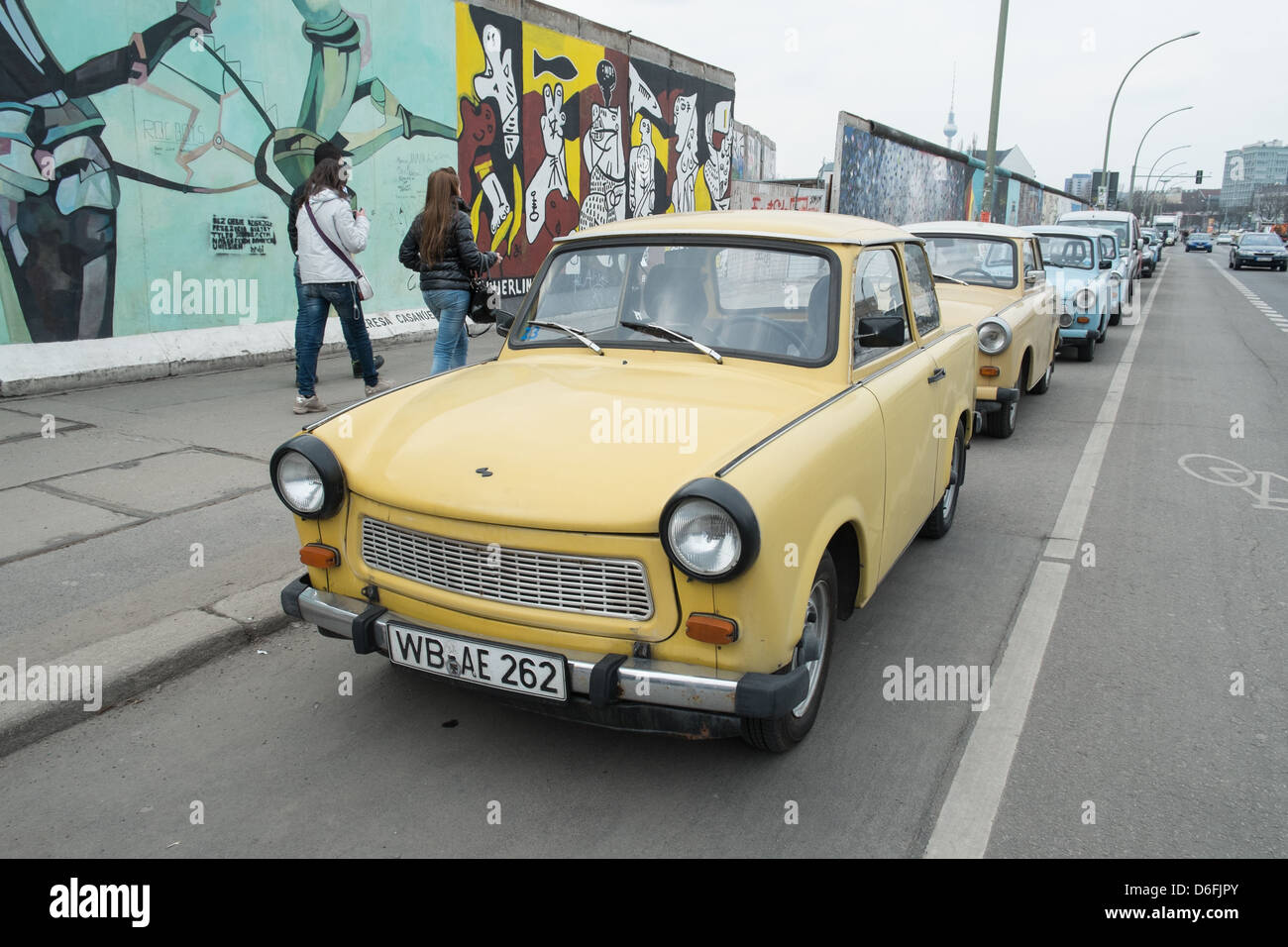 Trabant motor vehicle parked adjacent the Berlin Wall at the Eastside ...