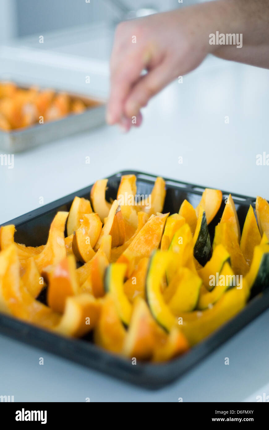Preparing roast squash Stock Photo - Alamy