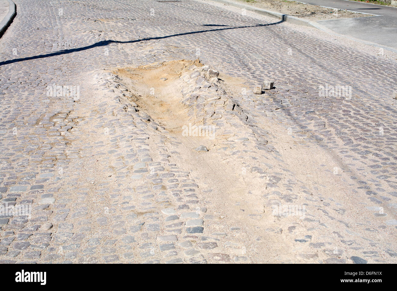 old ruined waved cobblestone street Stock Photo - Alamy