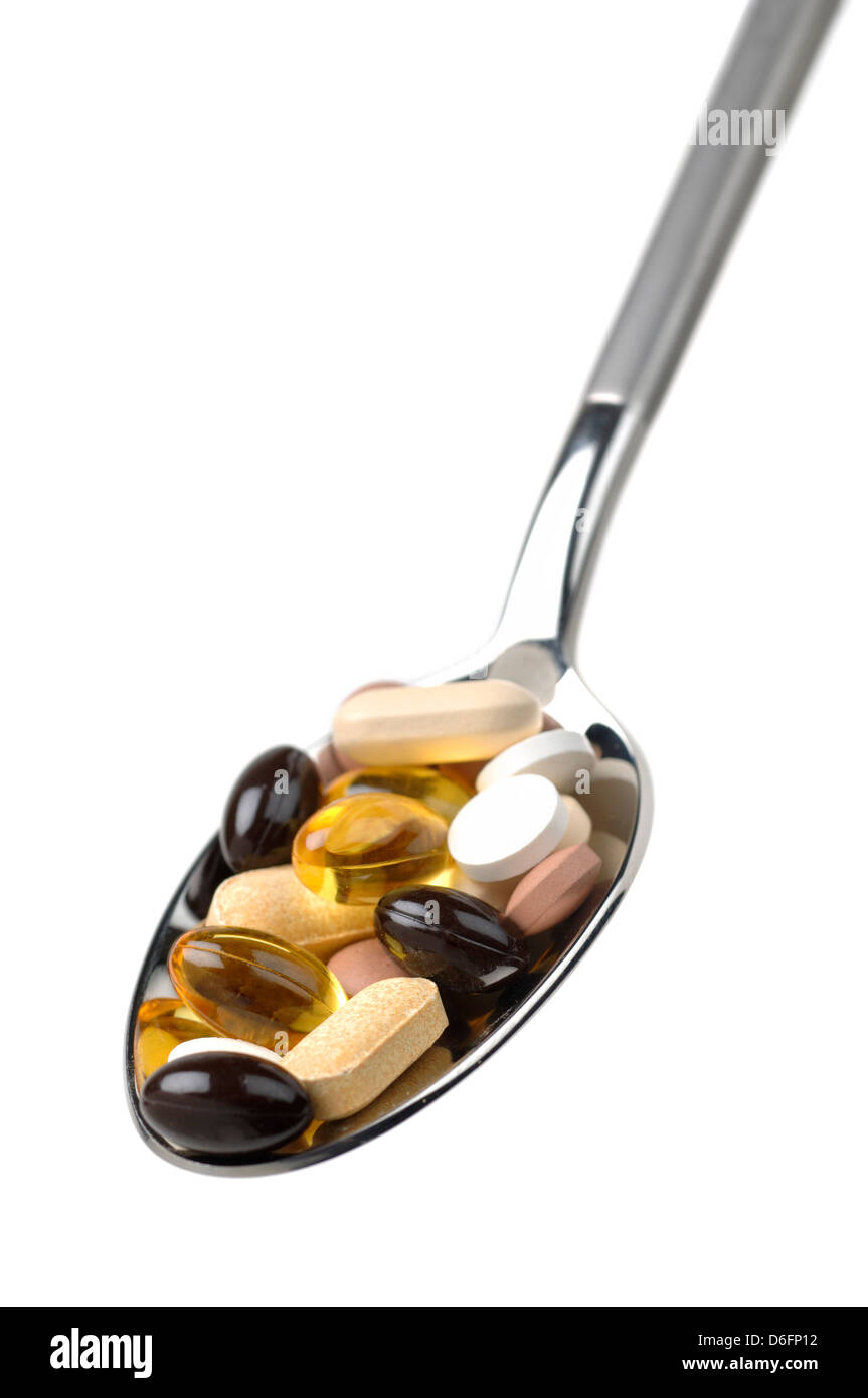 Spoonful of vitamins and food supplements Stock Photo - Alamy