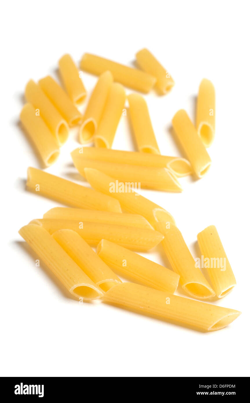 Dried pasta, penne, on white background Stock Photo - Alamy