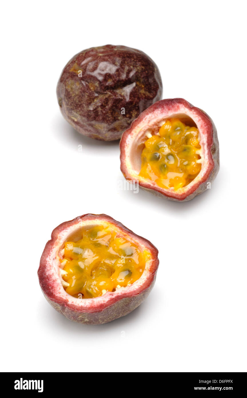 Passion fruit, halved, on white background Stock Photo - Alamy