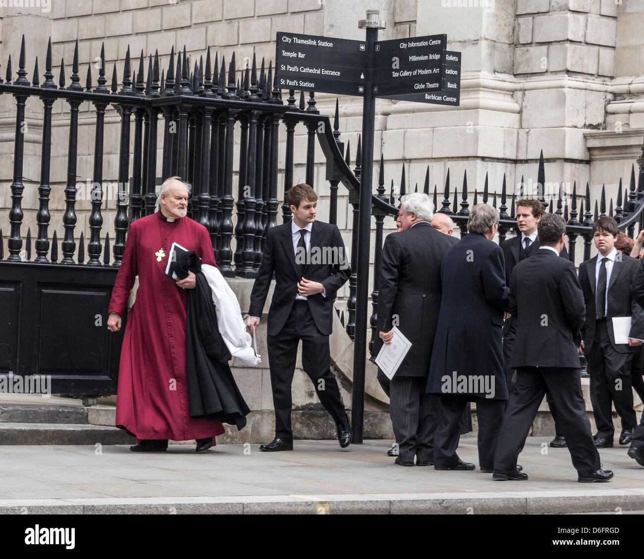 Bishop of London leaves St Paul's Cathedral after the funeral service ...