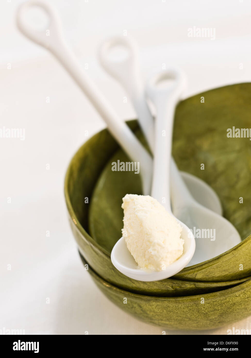 Double cream dollop; nested spoons in capiz bowls Stock Photo - Alamy