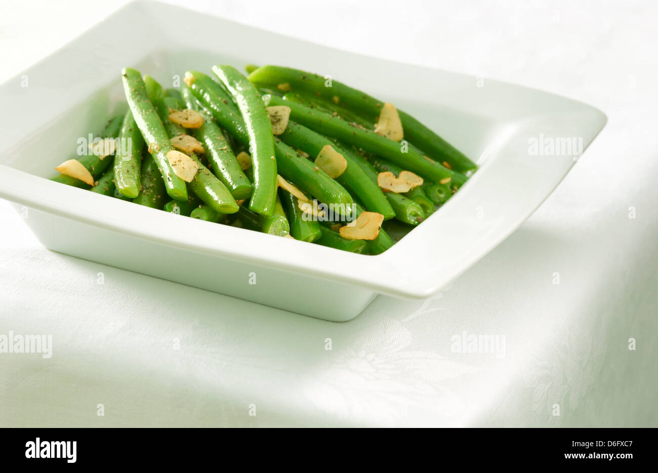Cooked runner beans and garlic Stock Photo - Alamy