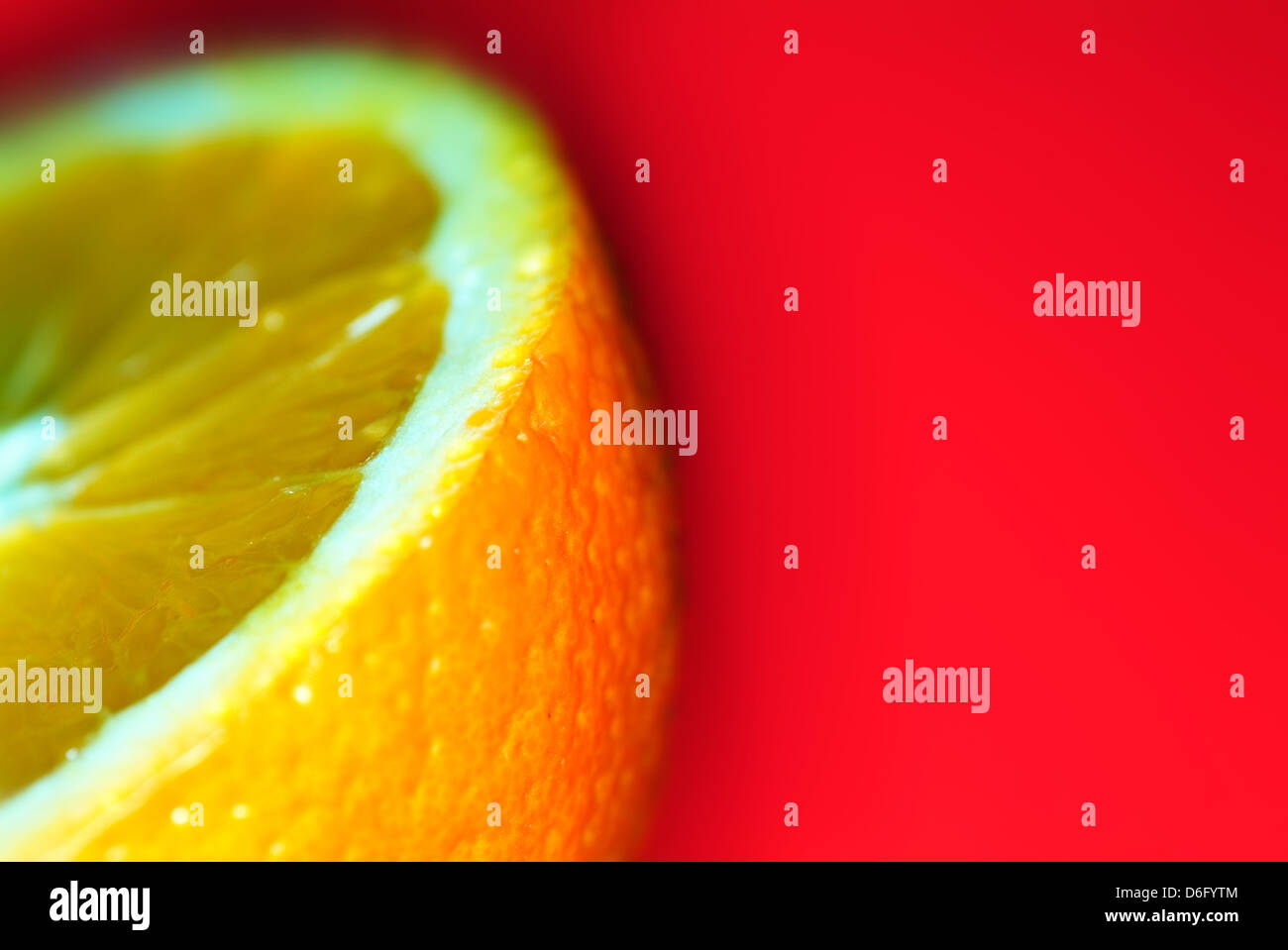 Lemon on red Stock Photo - Alamy